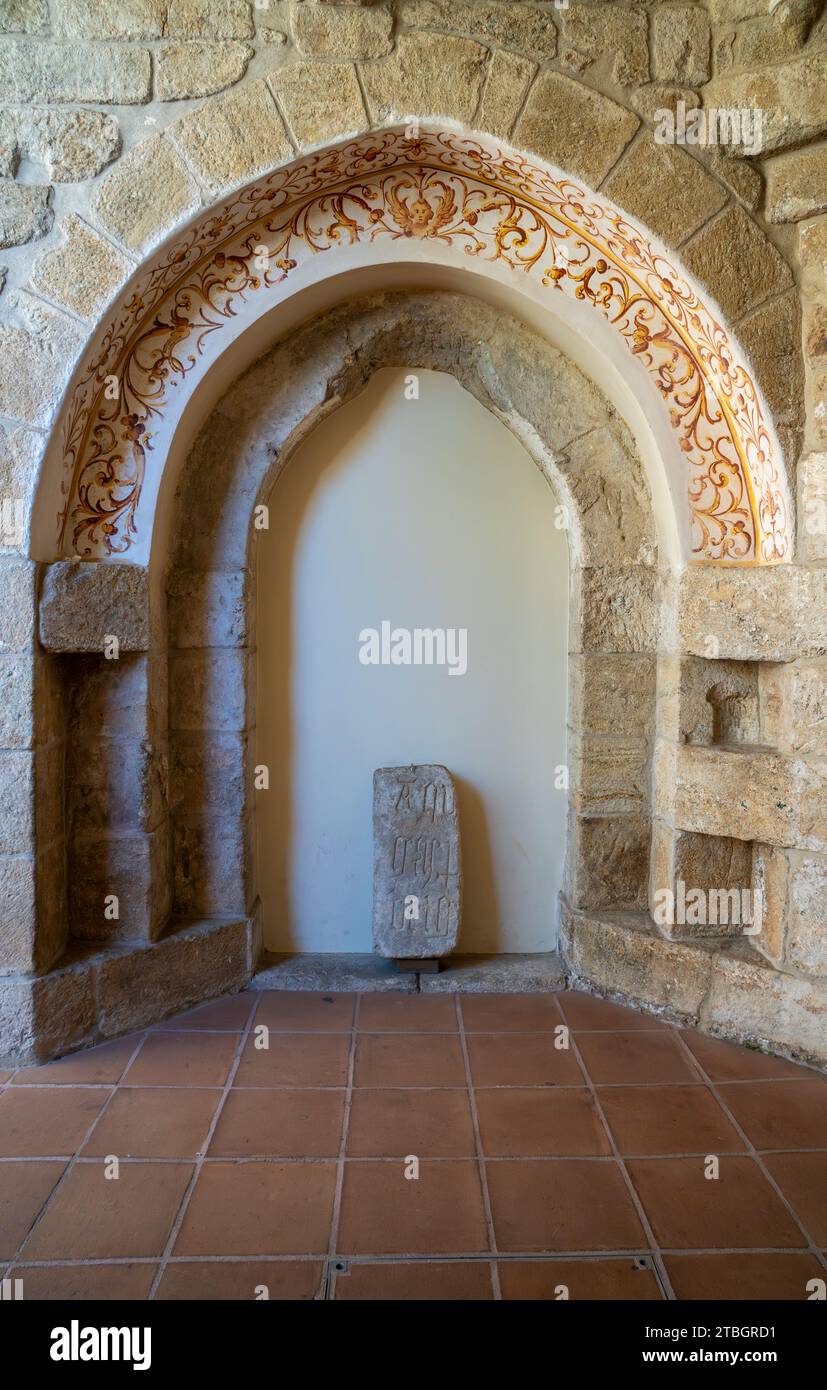 Arch finished in stone angle with architectural details and paintings ...