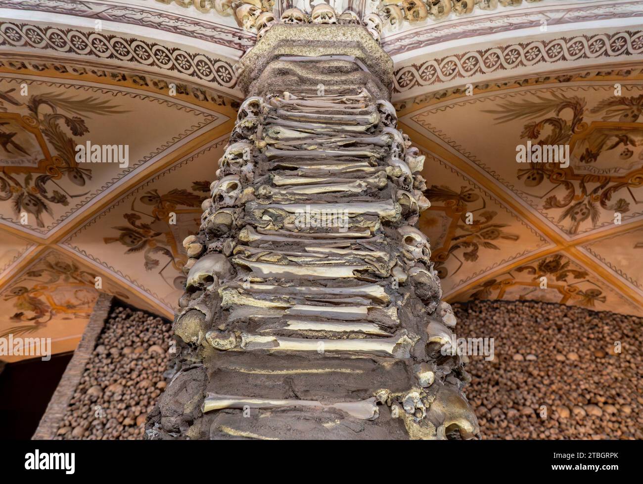 Column covered and decorated with human bones and skulls and the ...