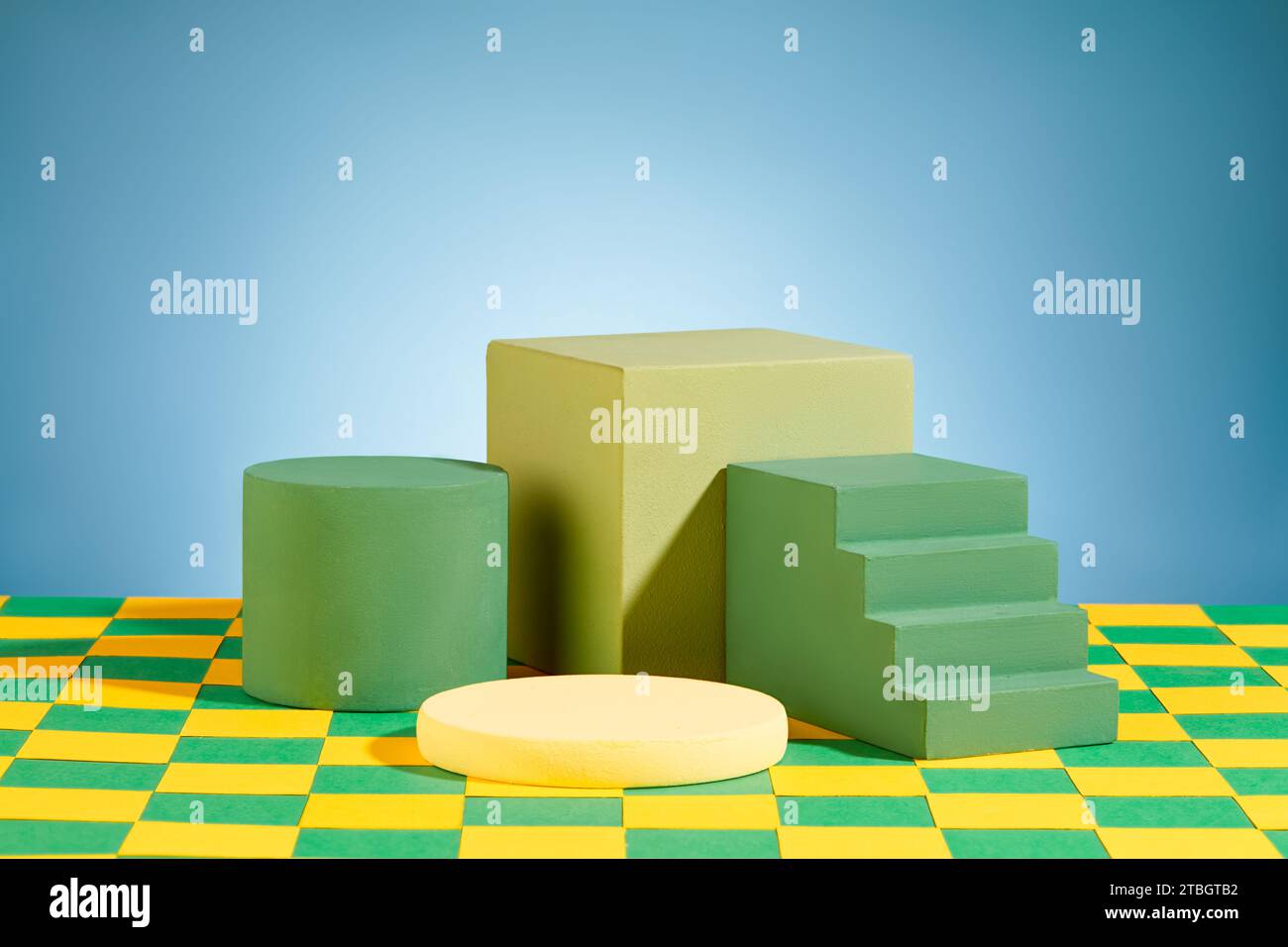 A set of geometric shape podiums are arranged over the blue background ...