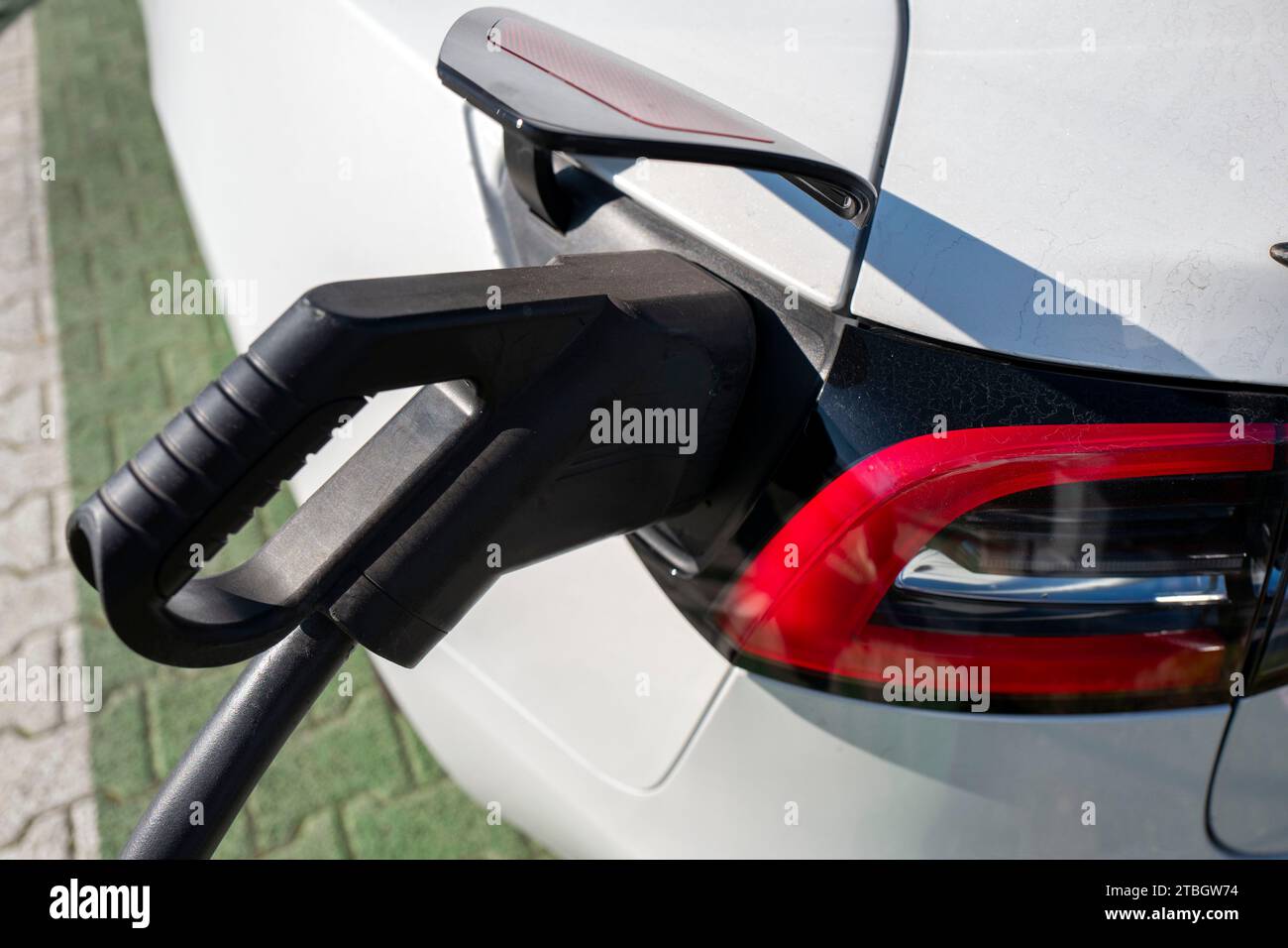 Tesla model 3 electric car rapid charging on a public power station ...