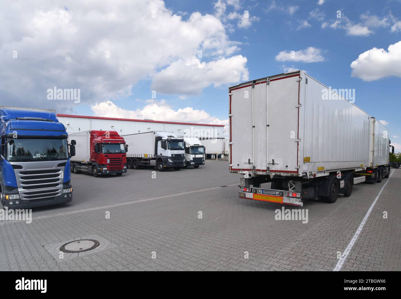 Trucks loading at a depot of a forwarding agency - Transport and ...