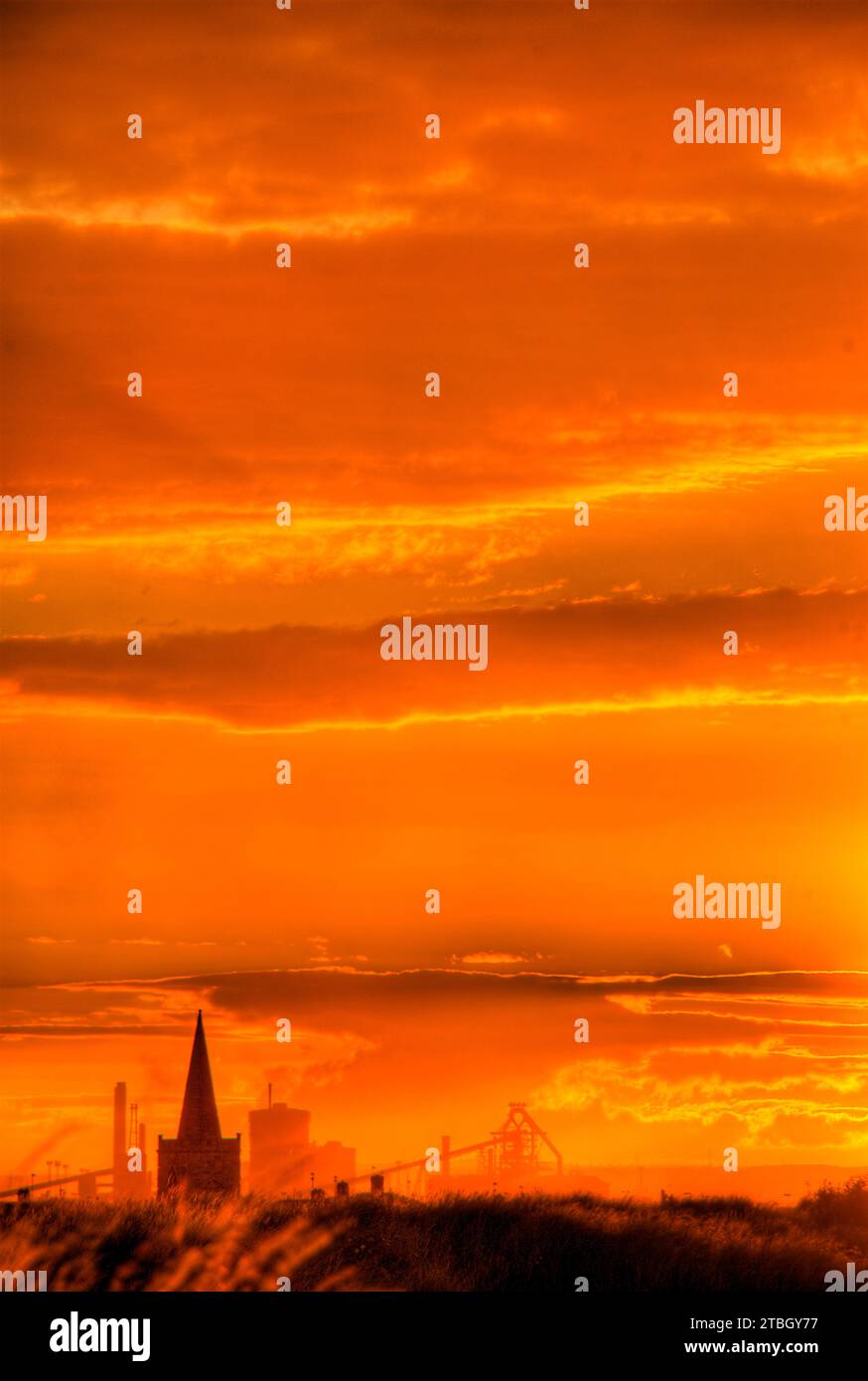 st germains church and british steel blast furnace at sunset at marske ...
