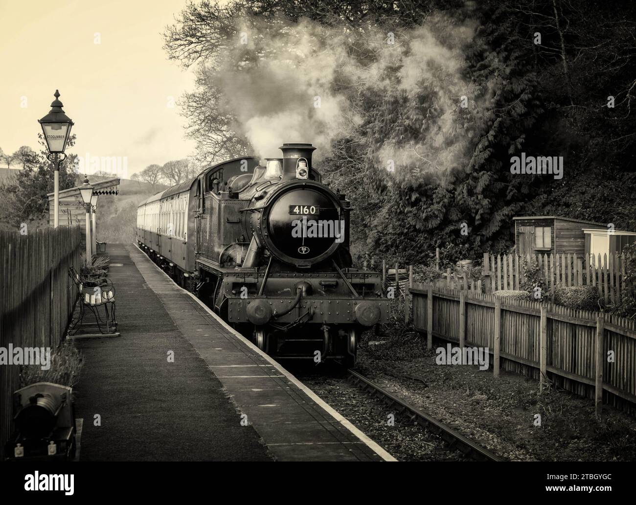 4160 Steam Train approaching Stogumber Station in sepia Stock Photo - Alamy