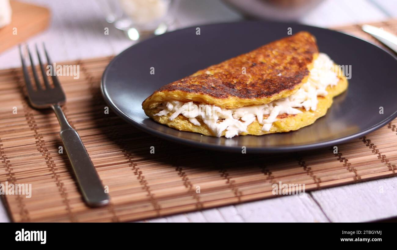 Corn cachapas with white cheese, typical Venezuelan dish Stock Photo ...