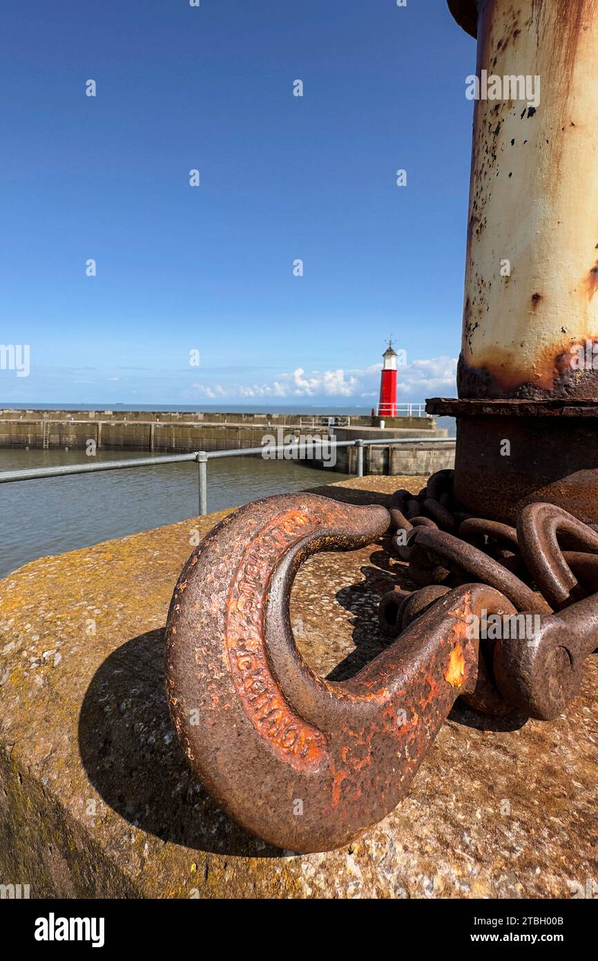 rusty iron hook and mock lighthouse at harbour, watchet, somerset, uk ...