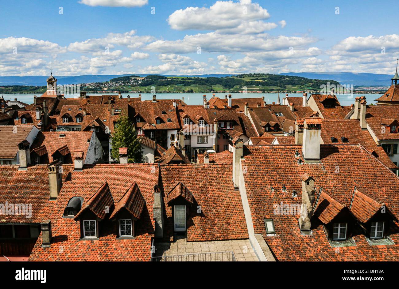 Roofs of the old city of Morat (Murten), Morat lake (Murtensee) and ...