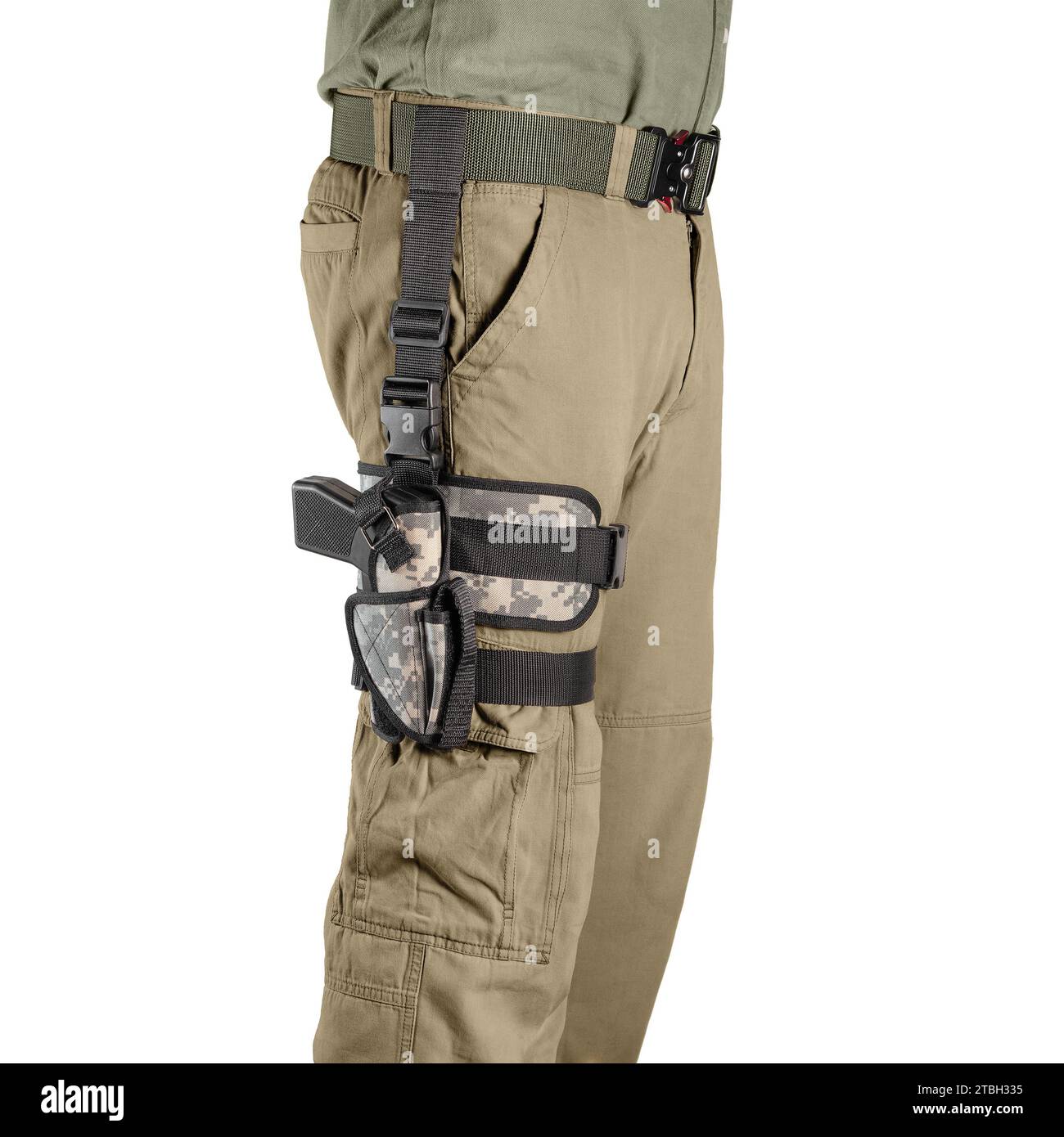 Man carrying pistol weapon in holster at hip. Tactical equipment Stock ...