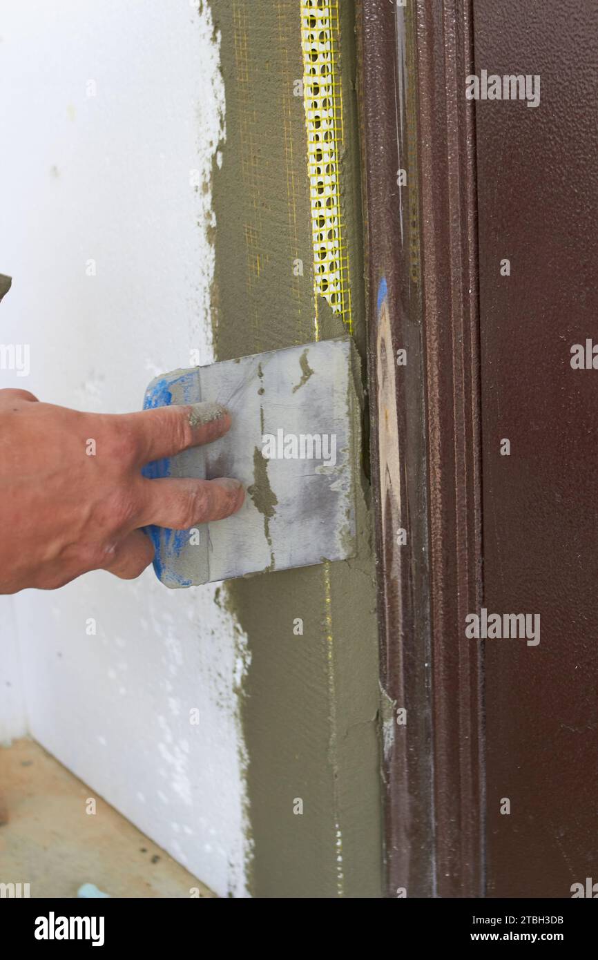 Construction worker plastering wall surface hi-res stock photography ...