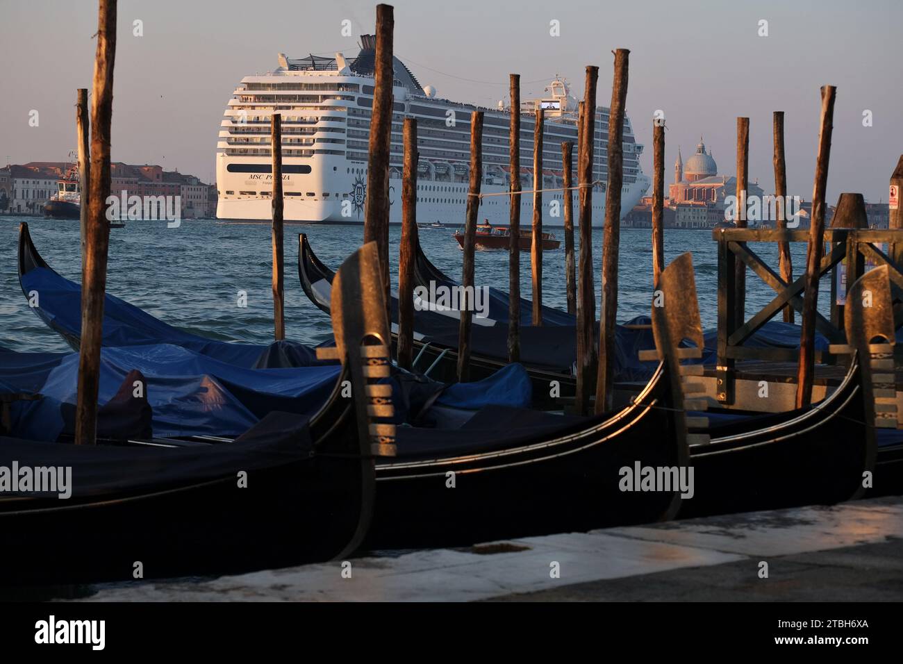 A giant cruise ship enters Guidecca canal dominating Redentore & the ...