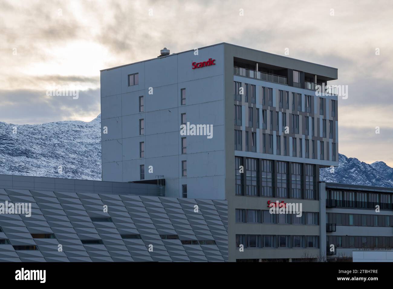 Scandic Syv Søstre hotel building along harbourside at Sandnessjoen ...