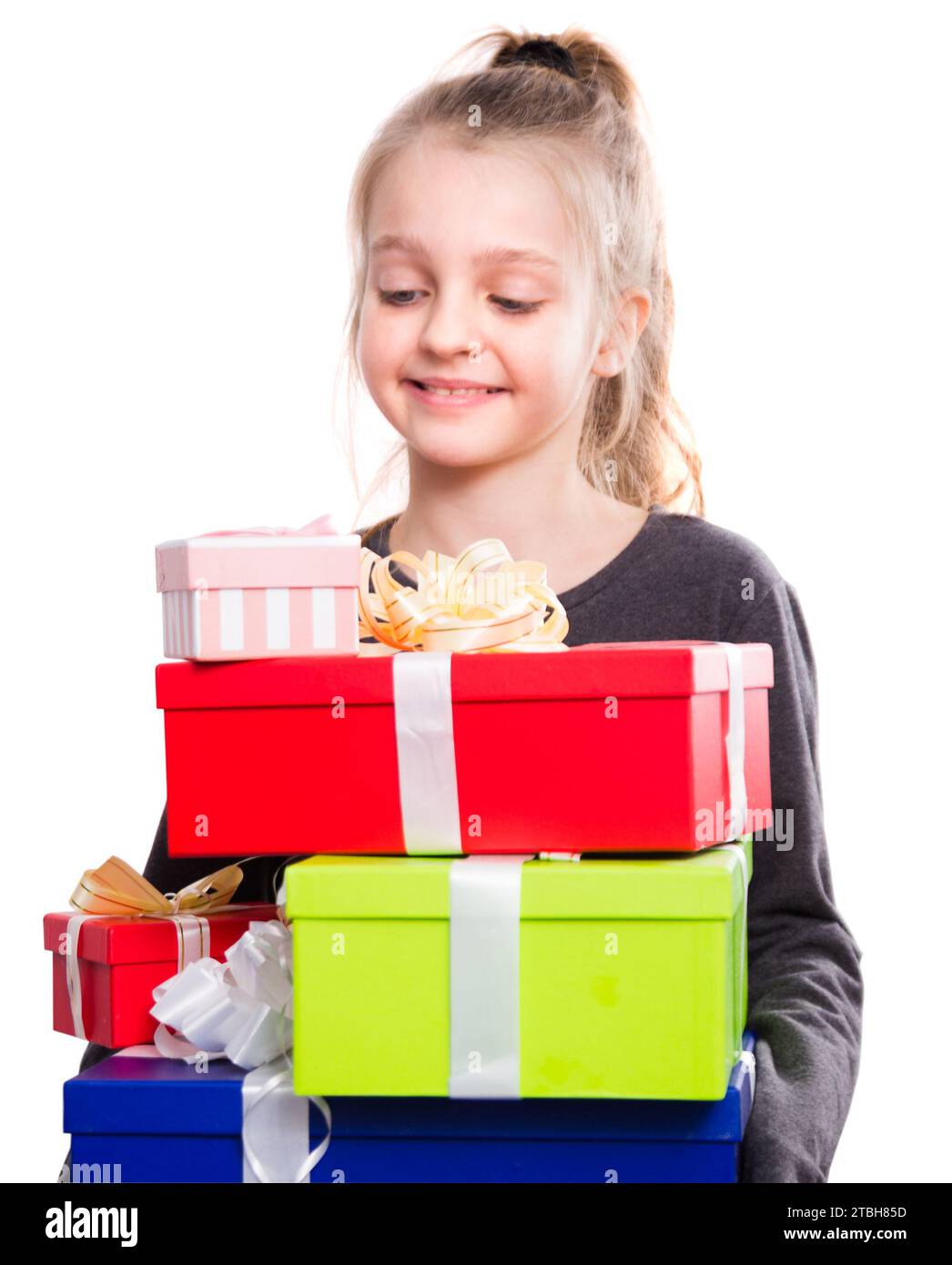 Child with a lot of gift boxes in hands on isolated background Stock ...