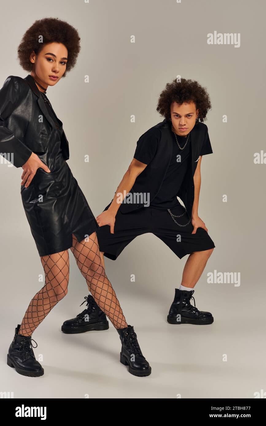 young african american brother and sister in black outfit posing ...