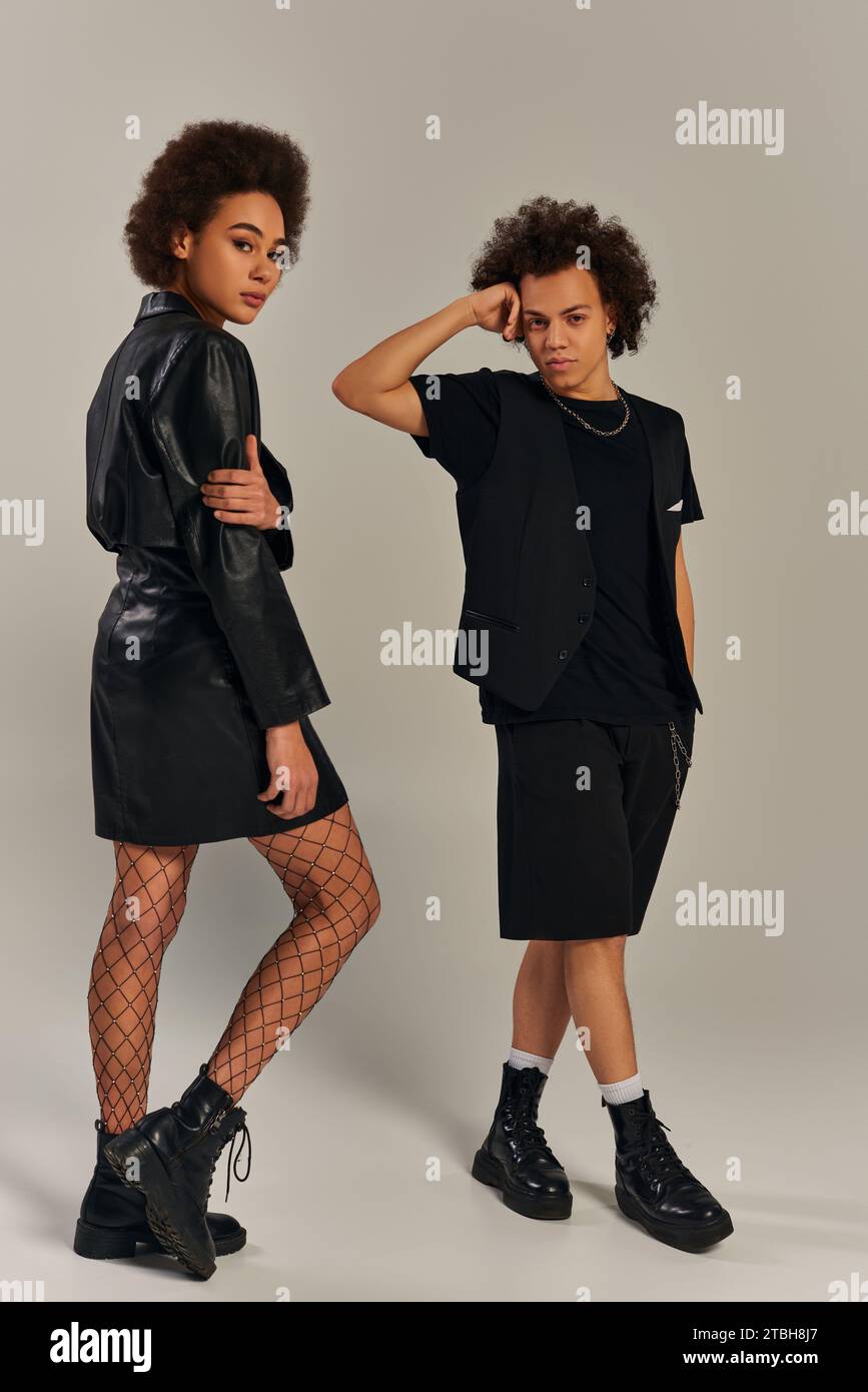 appealing african american siblings in stylish urban attire posing ...