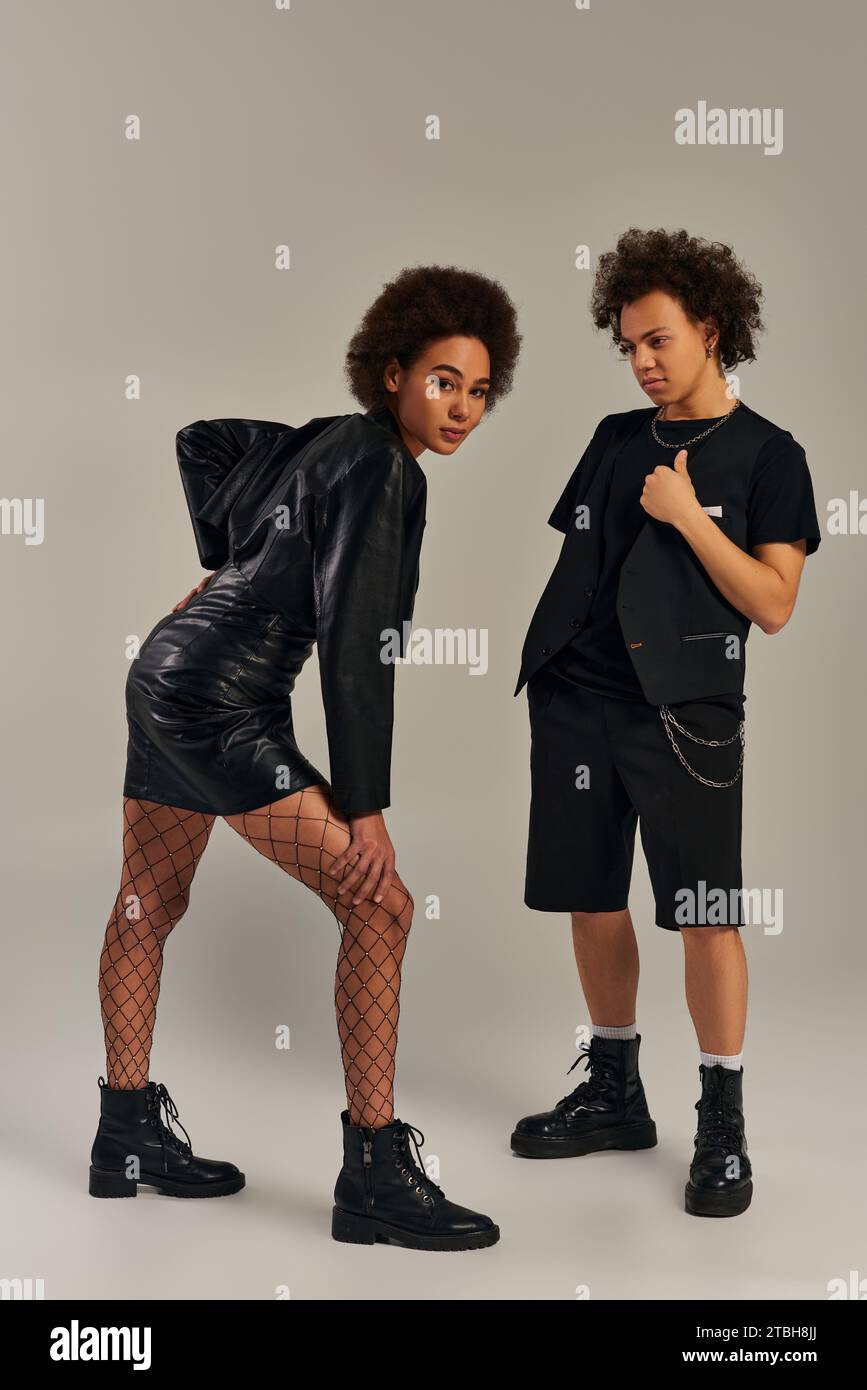 fashionable african american siblings in stylish elegant attire posing ...