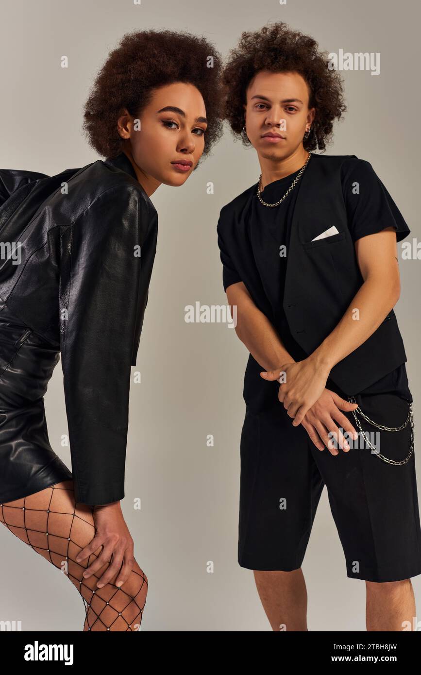 appealing african american siblings in stylish black urban attire ...