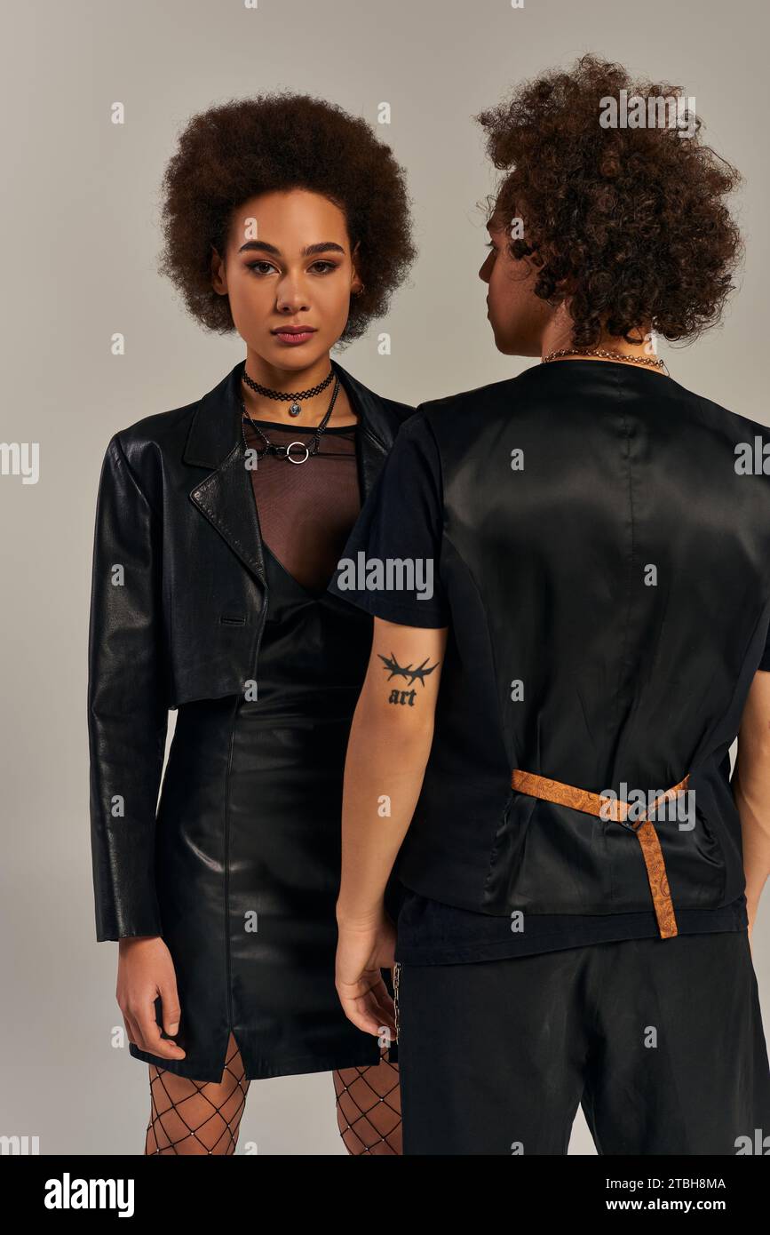 fashionable african american siblings in stylish black urban attire ...