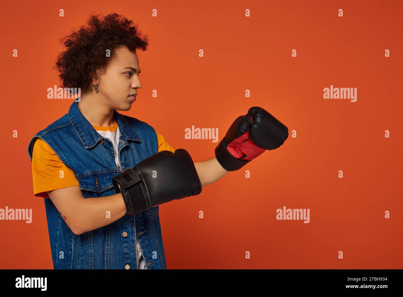 good looking athletic african american man posing lively in boxing ...