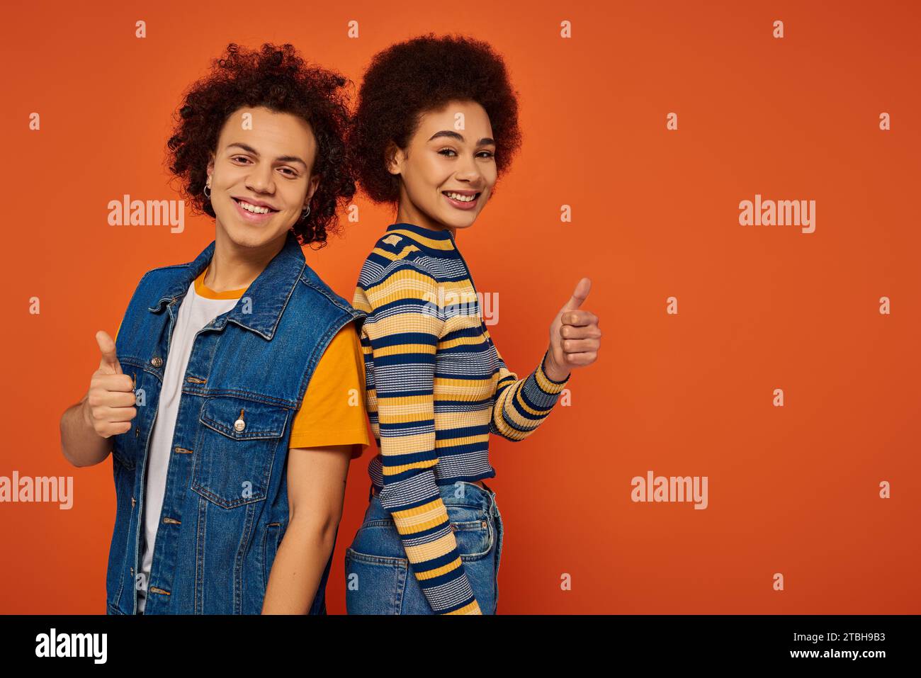 joyous attractive african american siblings posing together and ...