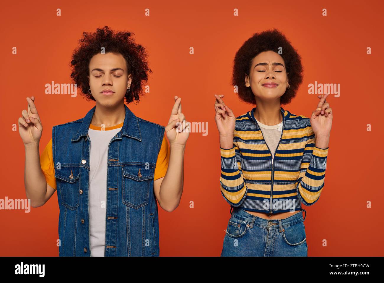 young attractive african american siblings posing together and making ...