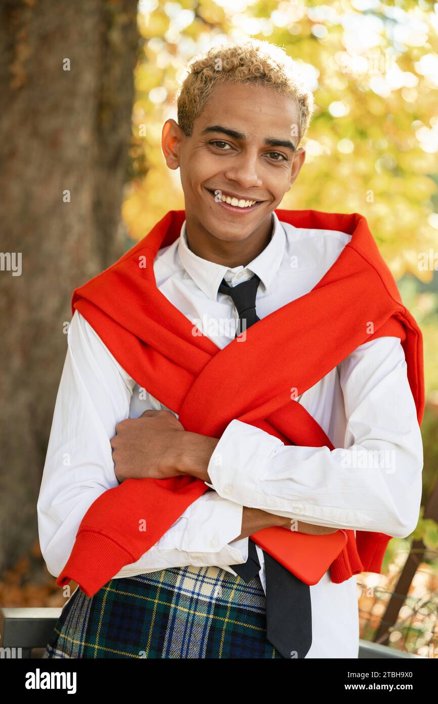 Beautiful boy posing and enjoying the day in the park , vertical photo ...