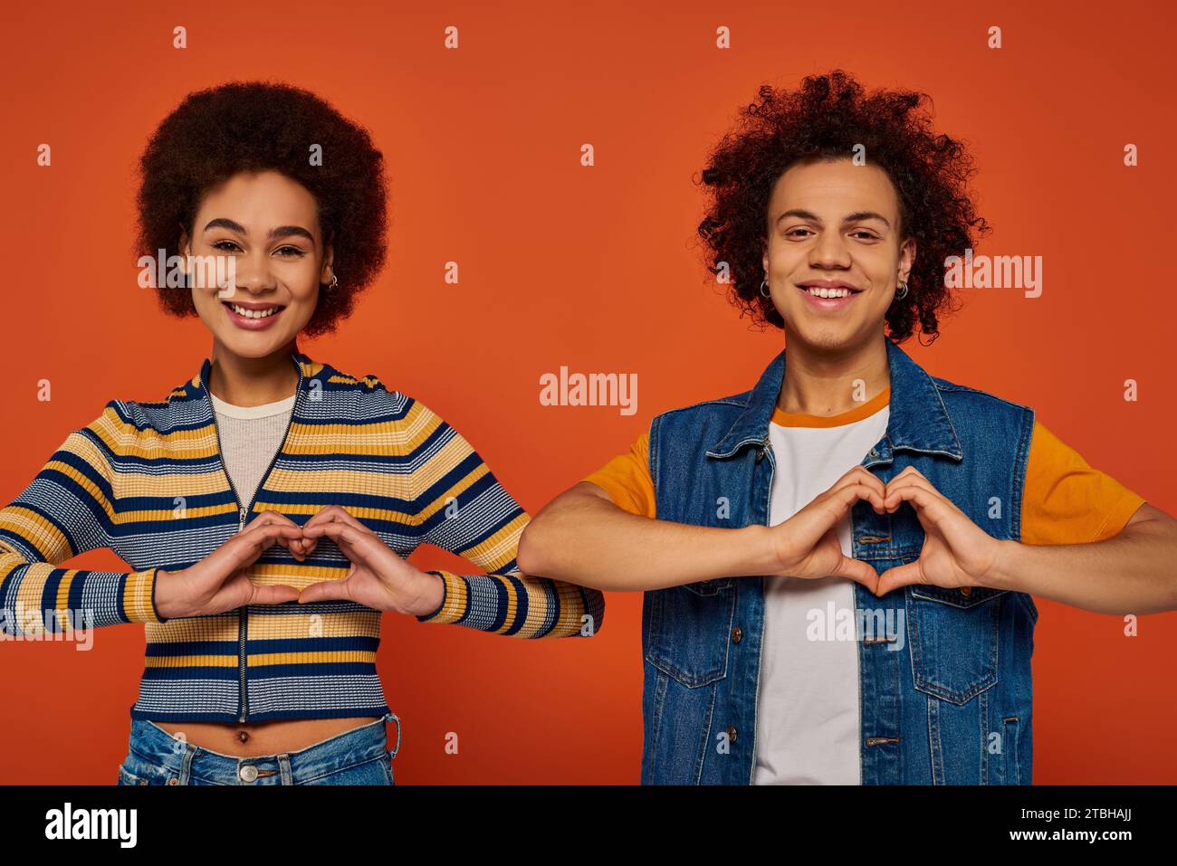 joyous african american brother and sister gesturing actively and ...