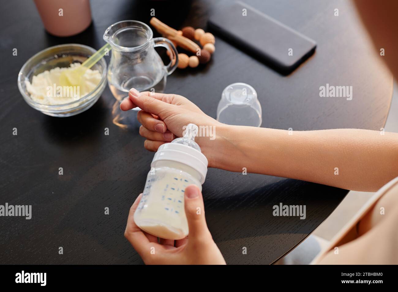 Mother Getting Ready for Baby Feeding Stock Photo - Alamy