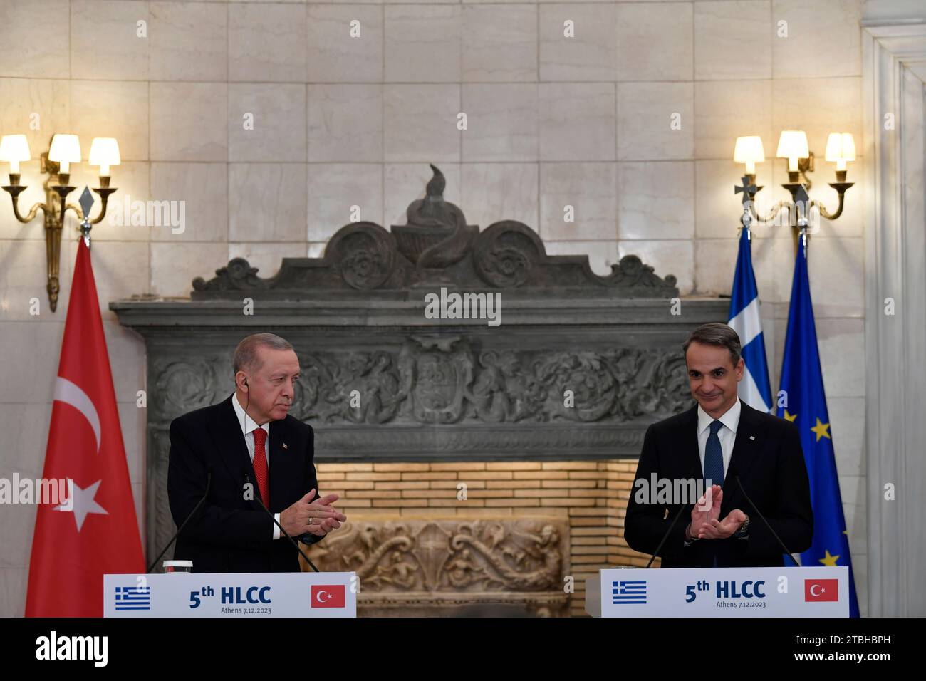 Greece's Prime Minister Kyriakos Mitsotakis, right, and Turkey's President Recep Tayyip Erdogan ...