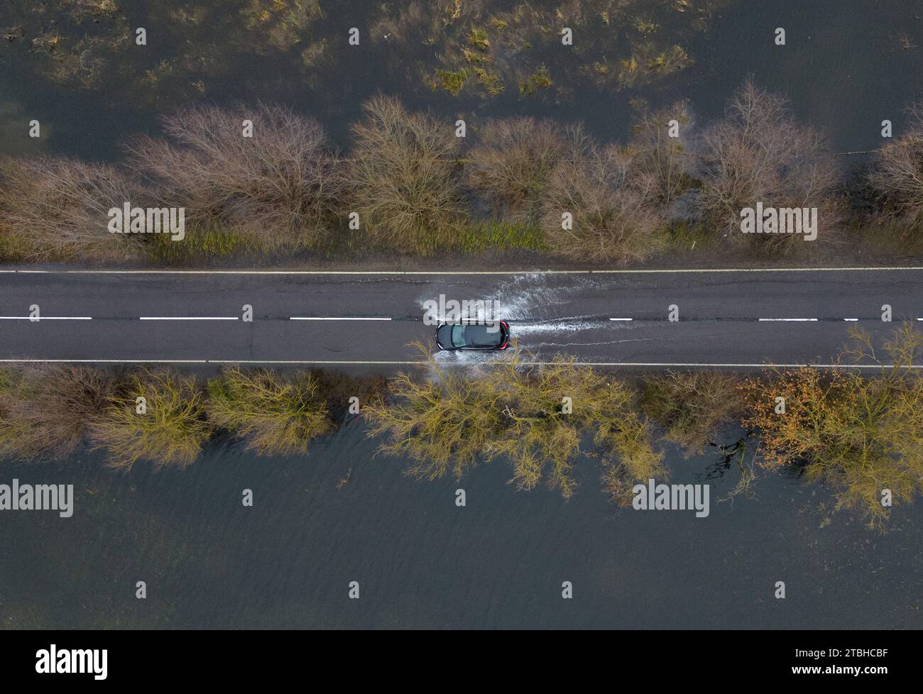 Cars make their way through surface water on the A1101 in Welney in ...