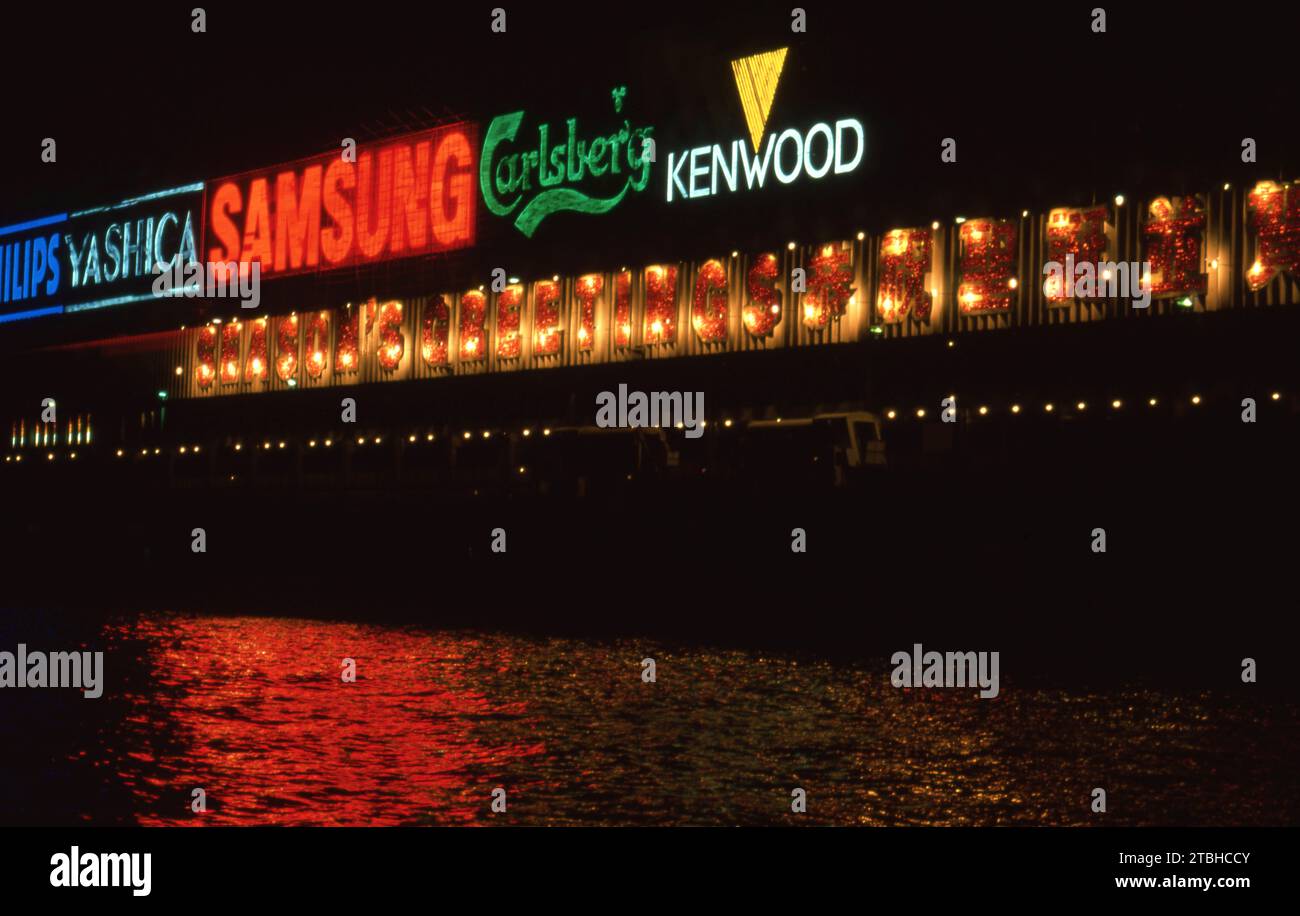 1988 Hong Kong Ocean Terminal, Kowloon side showing neon sign adverts ...