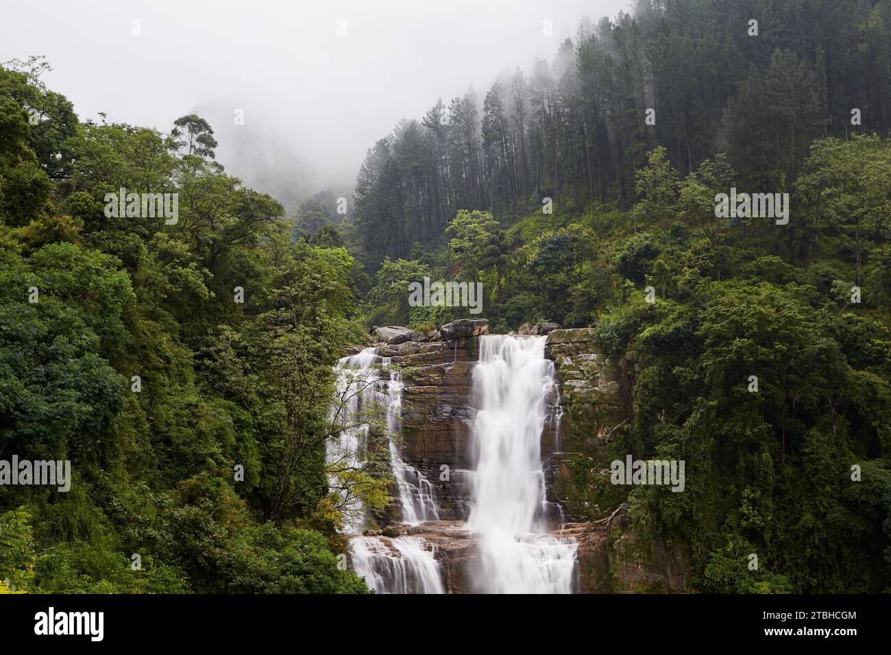 High waterfall full of water in the middle of nature. Ramboda falls ...
