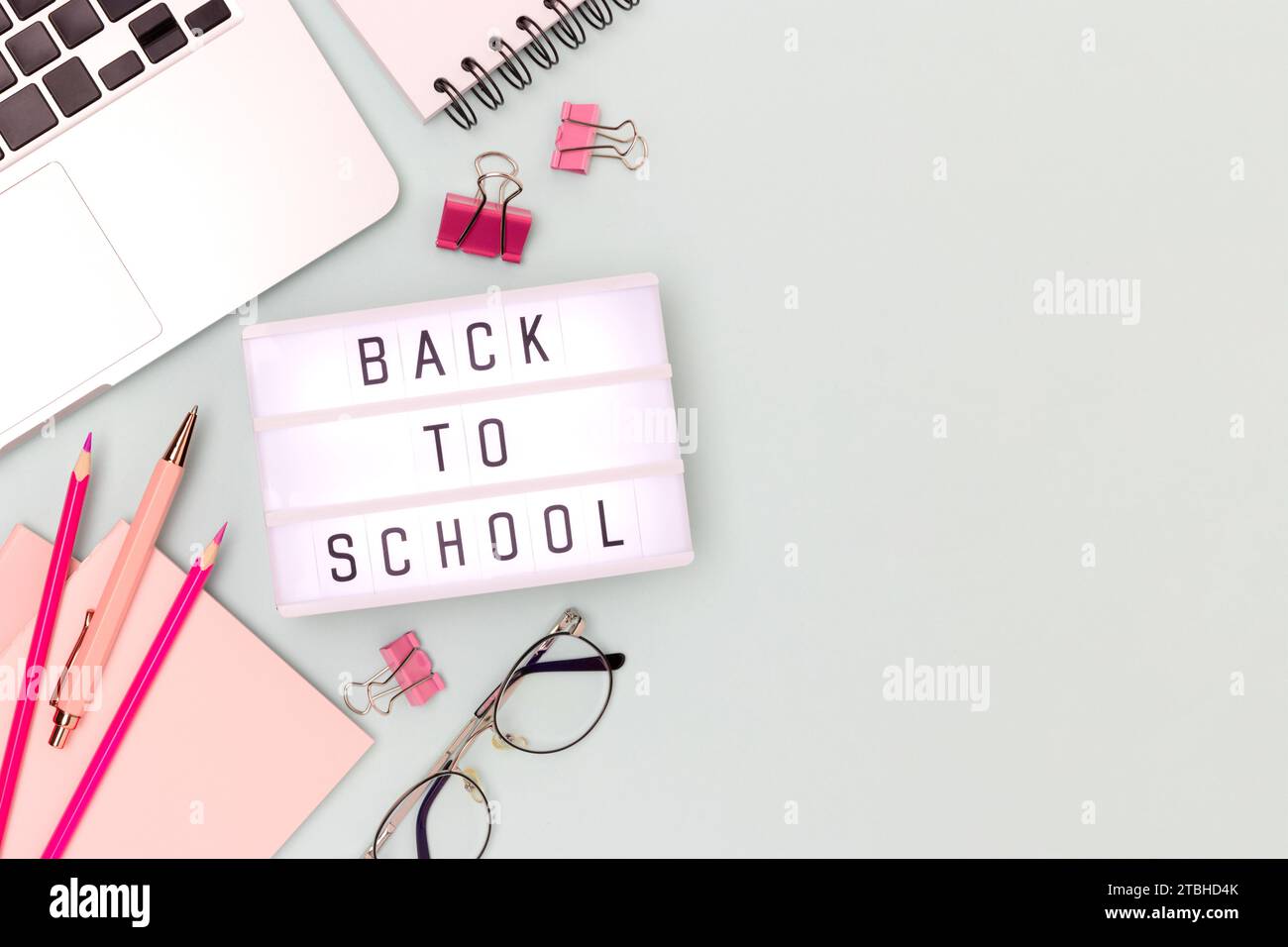 Back to school. Layout with lightbox, eyeglasses, laptop and stationery ...