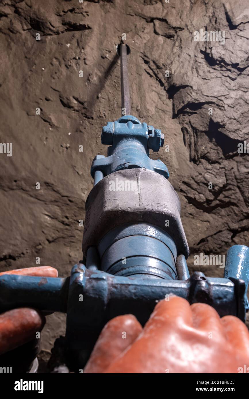 First person view - miner working with jackhammer in mine Stock Photo ...