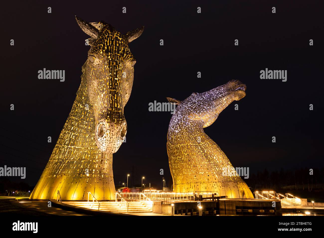 The Kelpies sculpture illuminated at night in Helix Park near Falkirk ...