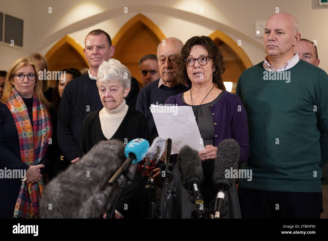 Julia Waters, sister of Ruth Perry, with other family members speaking ...