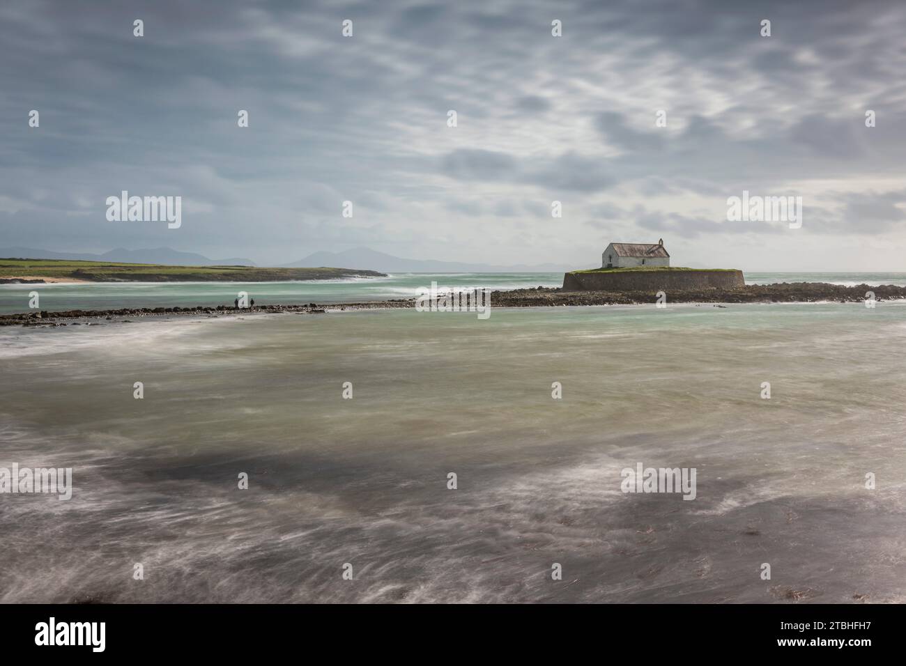 St Cwyfan's Church on a tidal islet near Aberffraw on the west coast of ...
