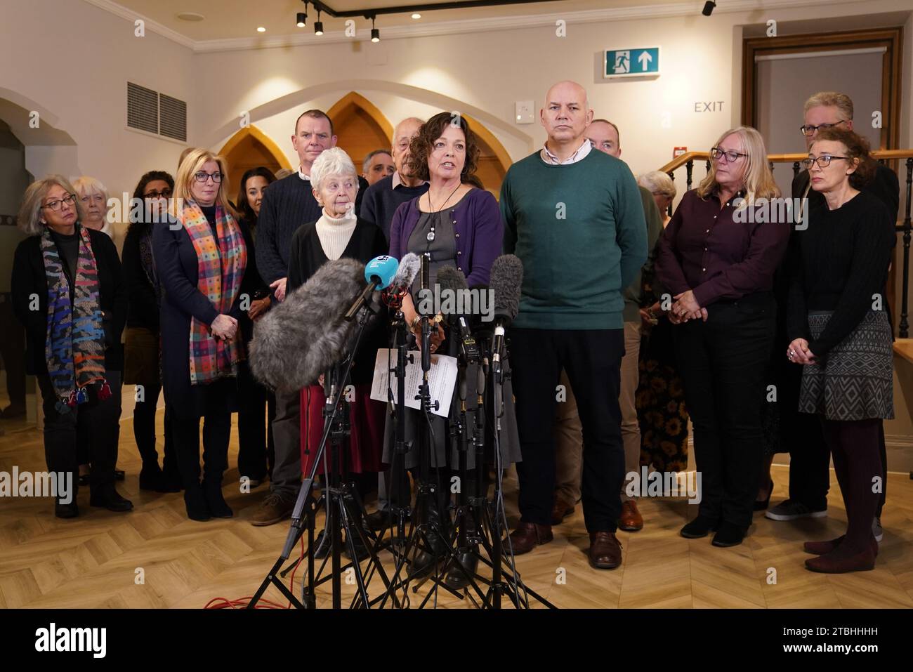 Julia Waters, sister of Ruth Perry, with other family members speaking ...