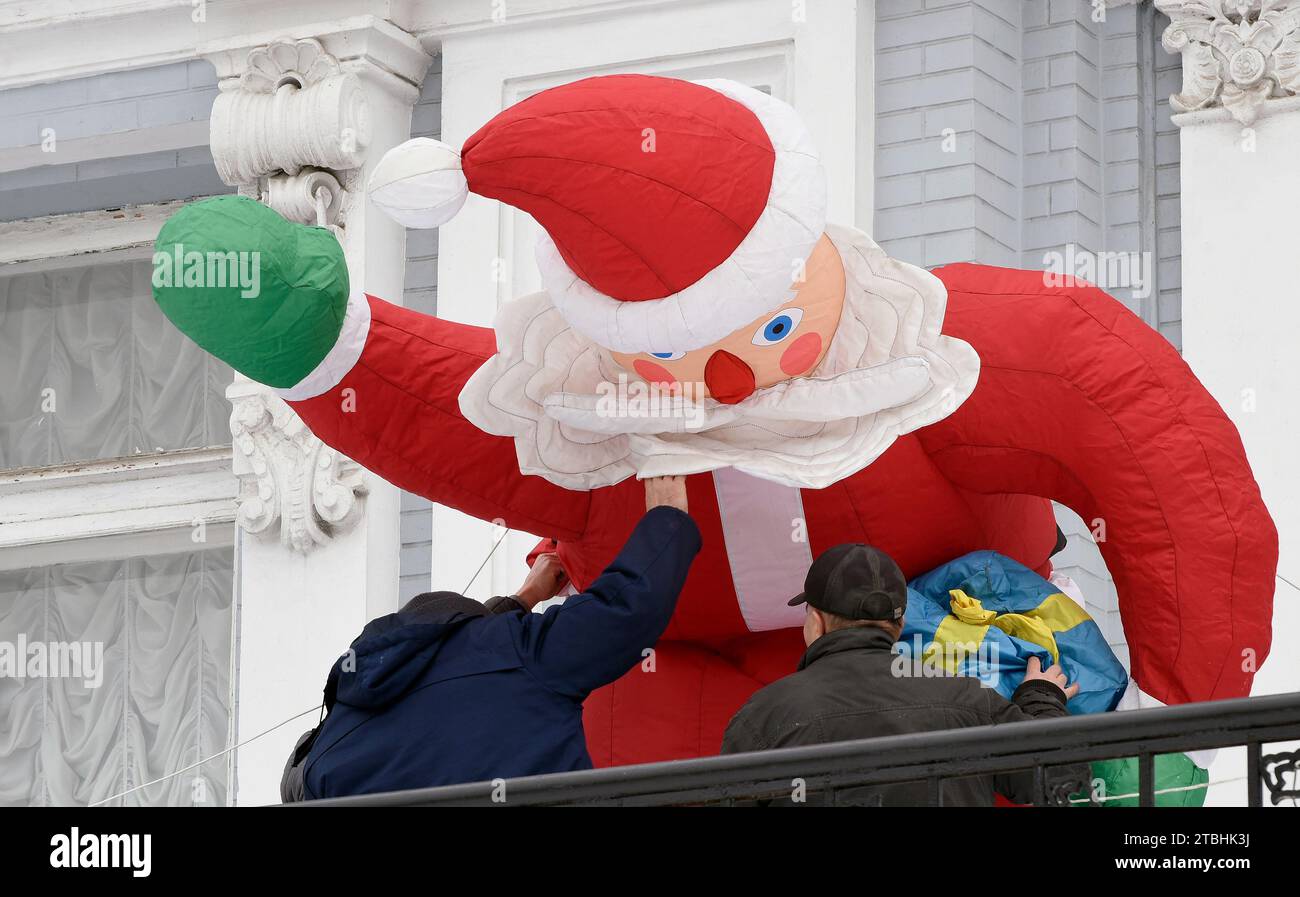KYIV, UKRAINE - DECEMBER 6, 2023 - Workers install an inflatable Santa ...