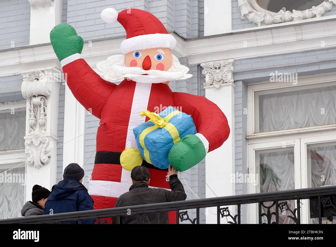 KYIV, UKRAINE - DECEMBER 6, 2023 - Workers install an inflatable Santa ...