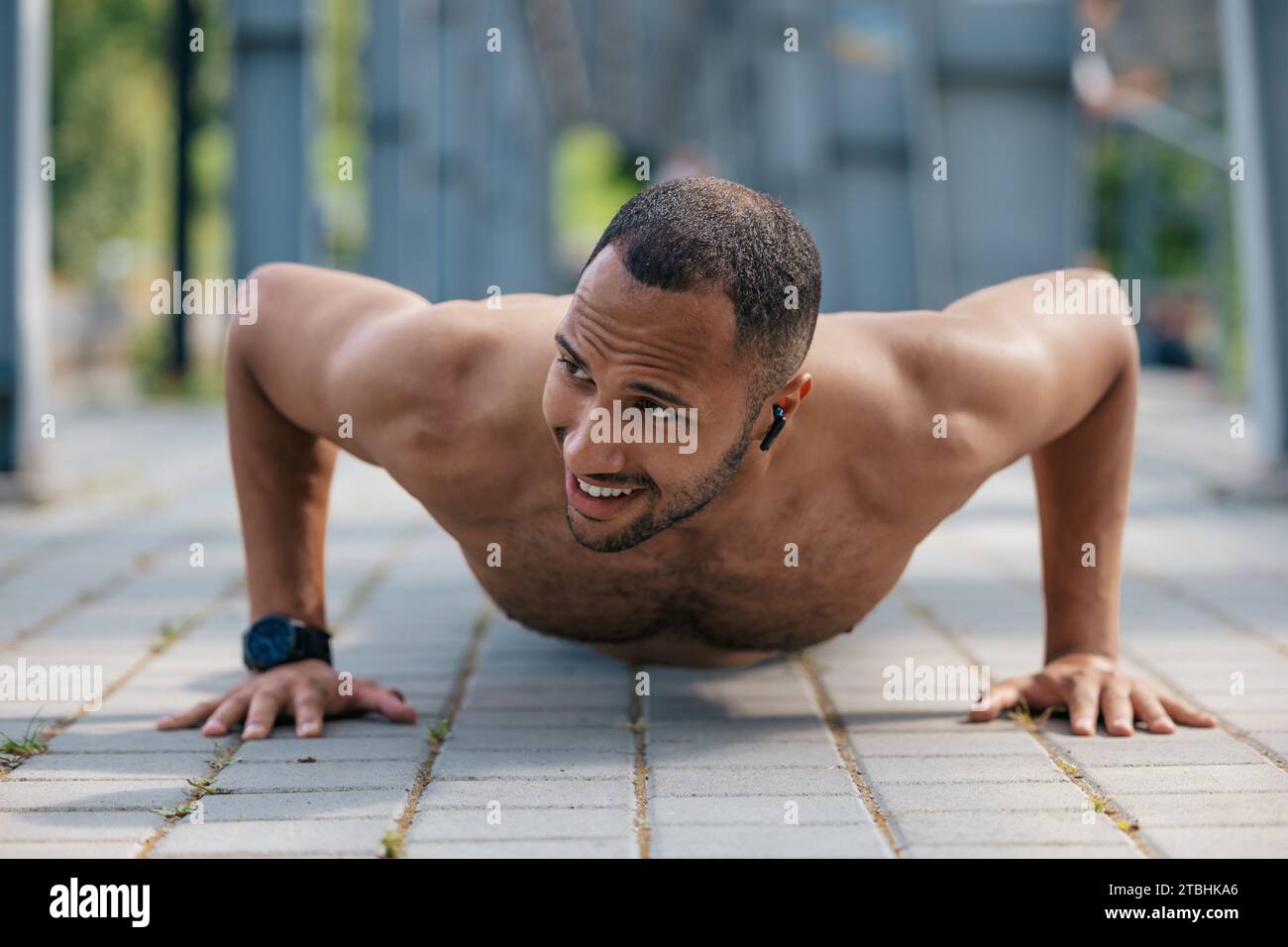 Strong muscular handsome man doing push ups Stock Photo - Alamy
