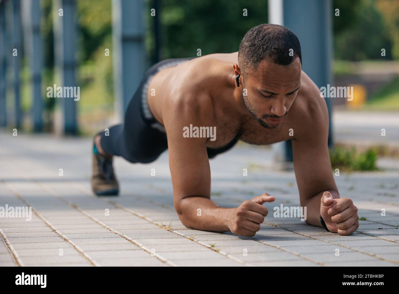 Young well-built african american man standing in plank Stock Photo - Alamy
