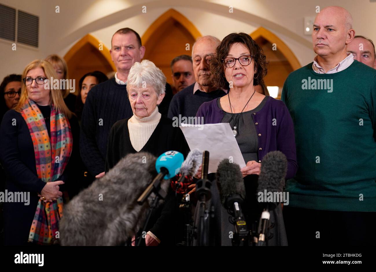 Julia Waters, sister of Ruth Perry, speaking to members of the media in ...