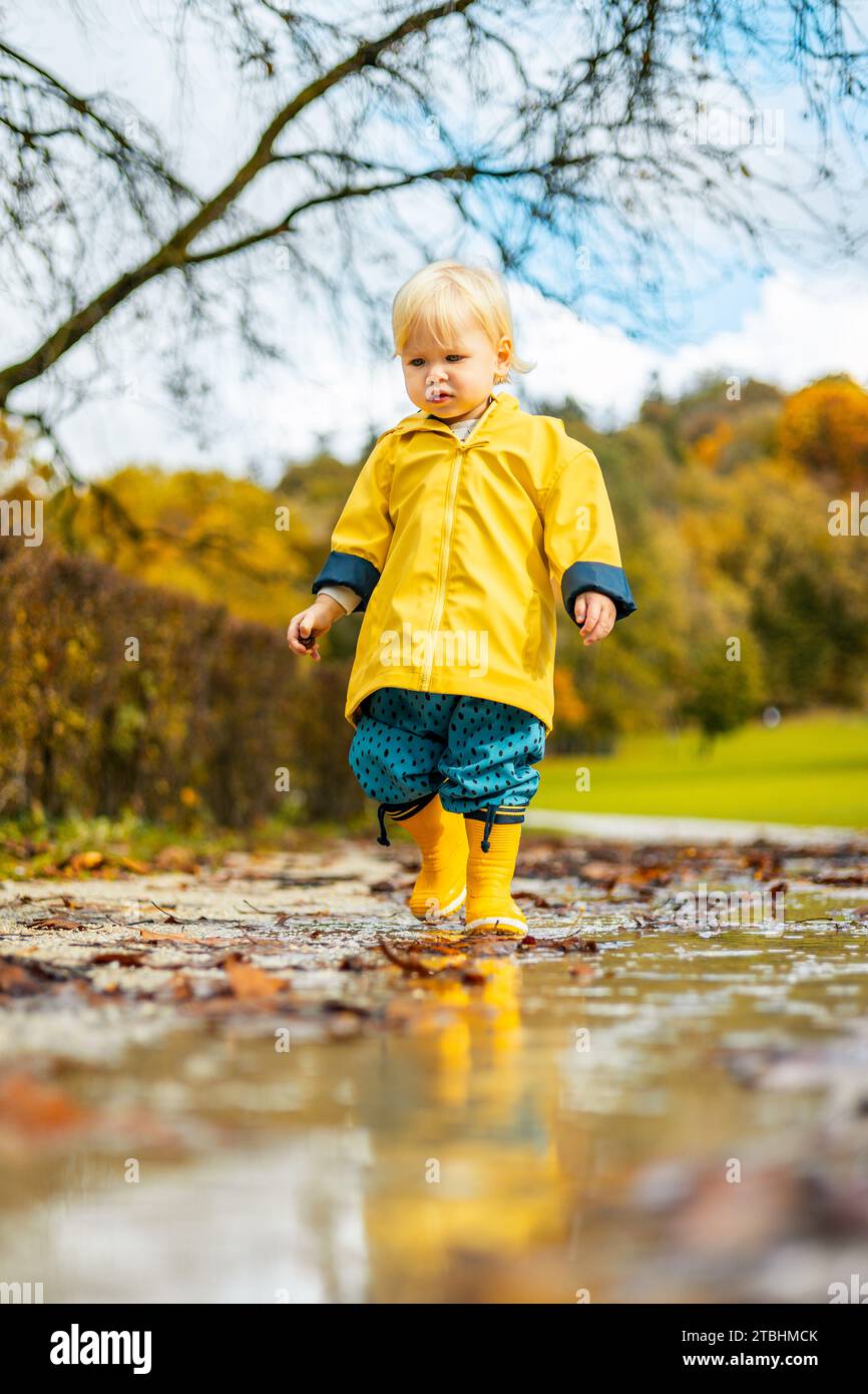 Sun always shines after the rain. Small bond infant boy wearing yellow ...