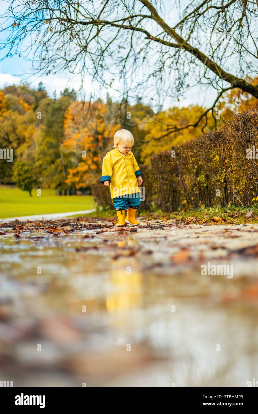 Sun always shines after the rain. Small bond infant boy wearing yellow ...