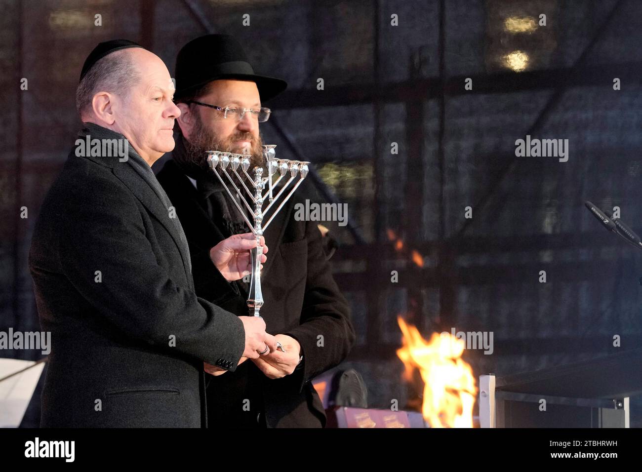 German Chancellor Olaf Scholz, left, and Rabbi Yehuda Teichtal attend ...