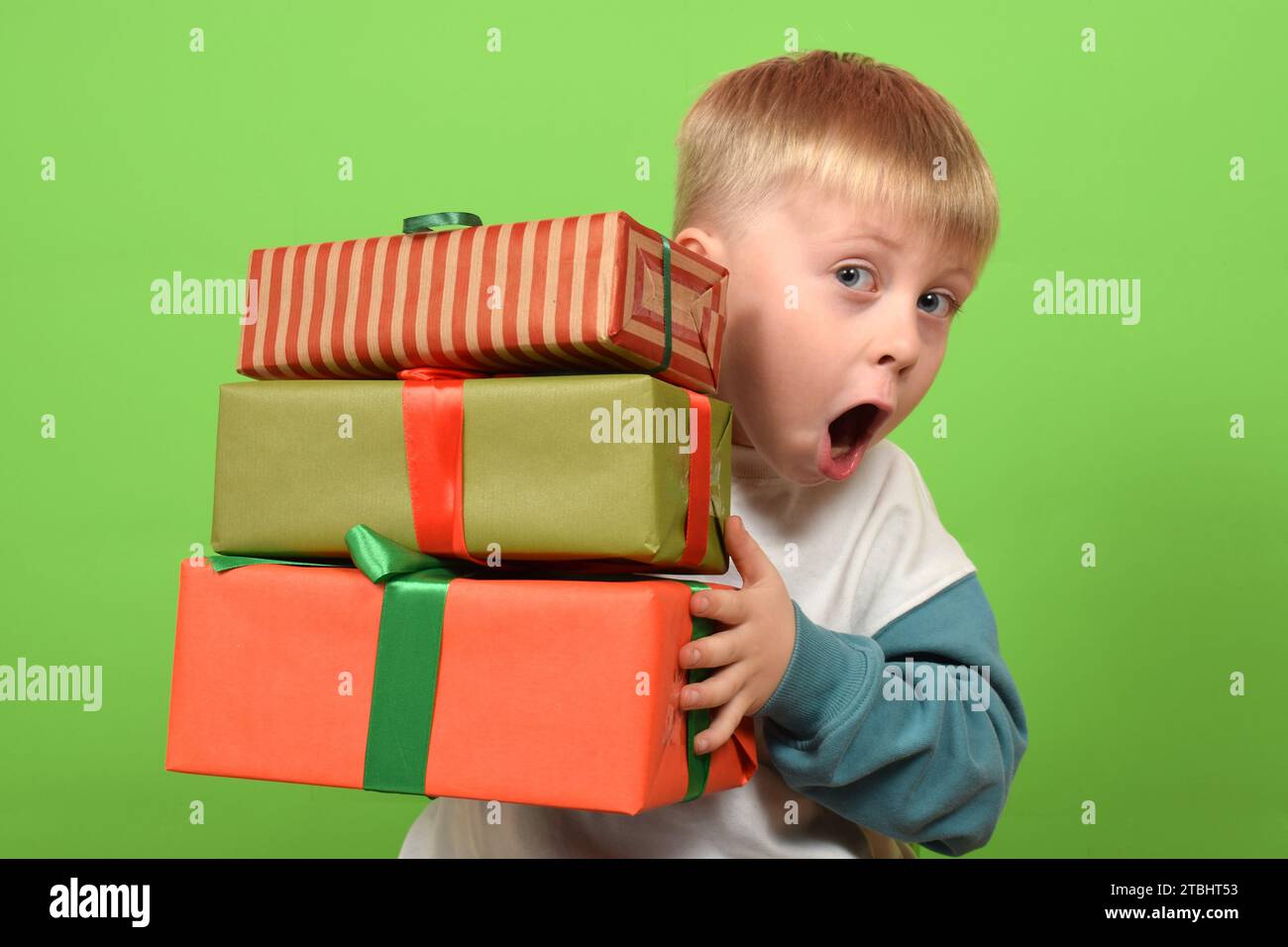 cute boy holding a gift box Stock Photo - Alamy