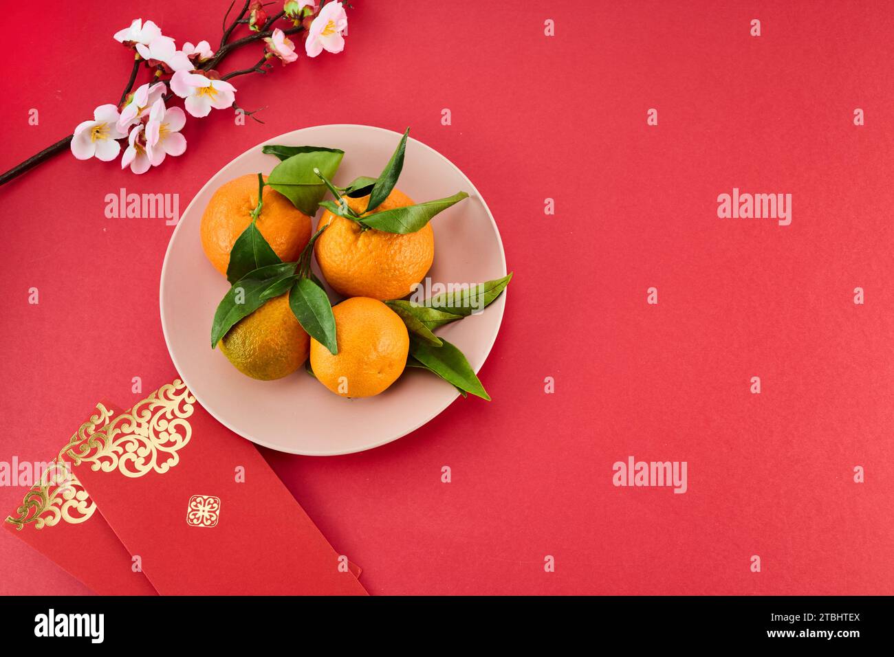 Chinese New Year. Red packet envelope, flowers, mandarins, festival ...
