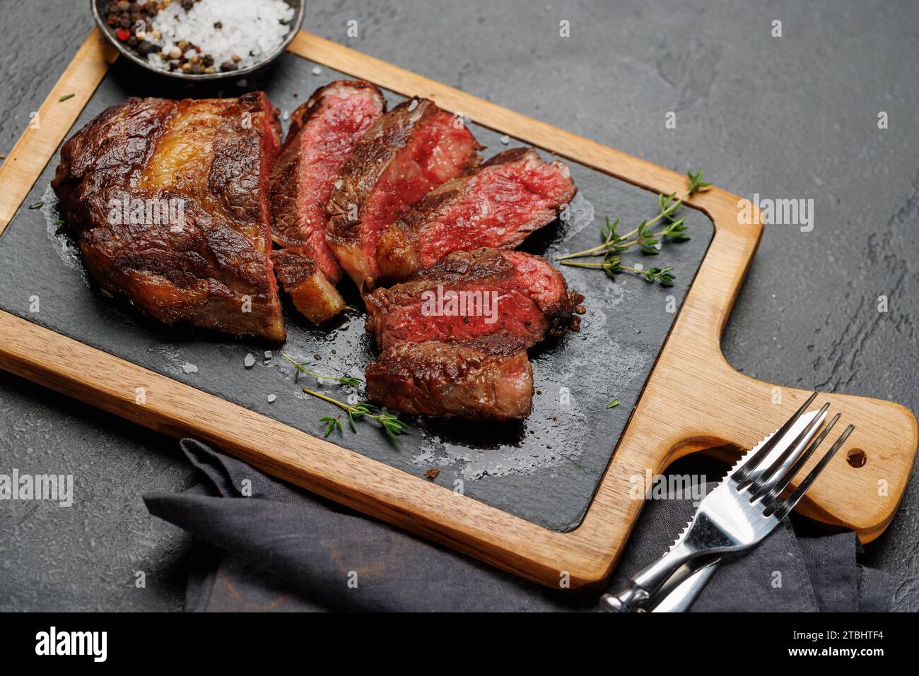 Deliciously juicy sliced beef ribeye steak, perfectly cooked and ready ...