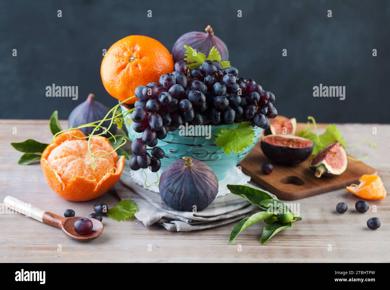 Season orange tangerine, figs and grape fruit mix with green leaves ...