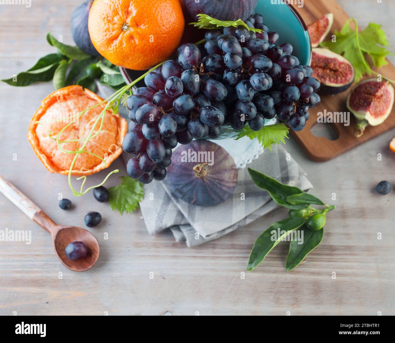 Fruit market. Orange tangerine, figs and grape fruit mix on grey wood ...