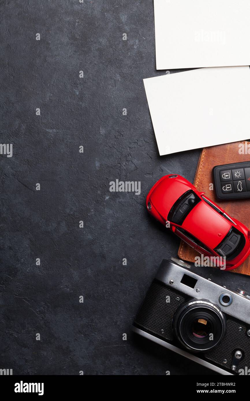 Travel vacation concept with passport, camera, car toy and photo frames ...